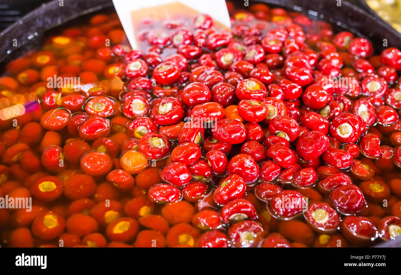 Red olives stuffed with tuna are on the market Stock Photo - Alamy