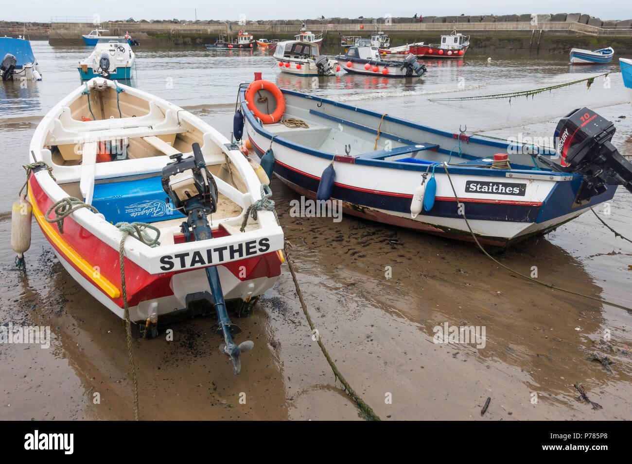 Fishing boats and cobles moored in Staithes Harbour North Yorkshire ...