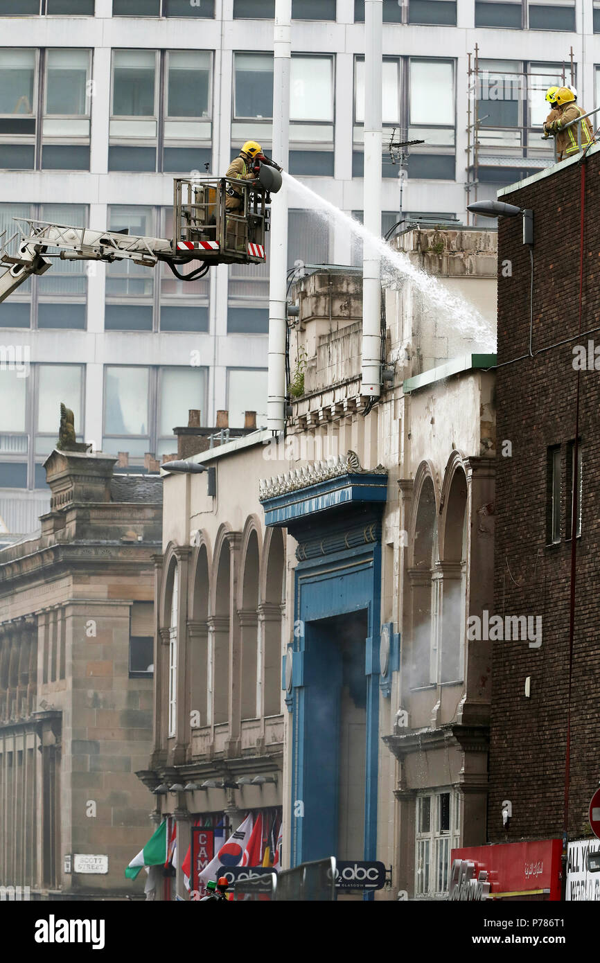 Firefighters douse the O2 ABC close to the historic Mackintosh Building ...
