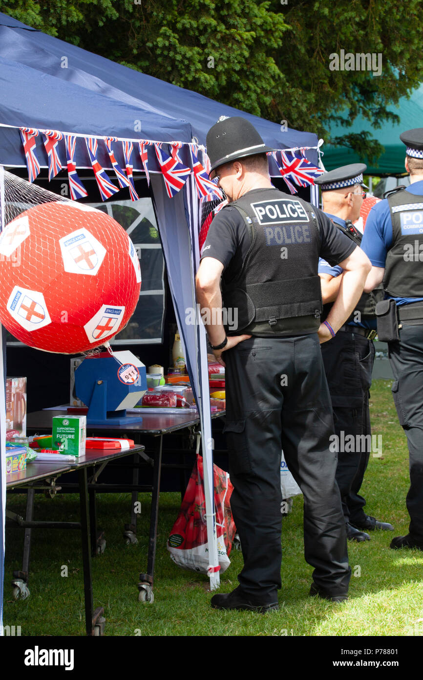 A police officer looks at a lucky dip stall on display at the armed ...