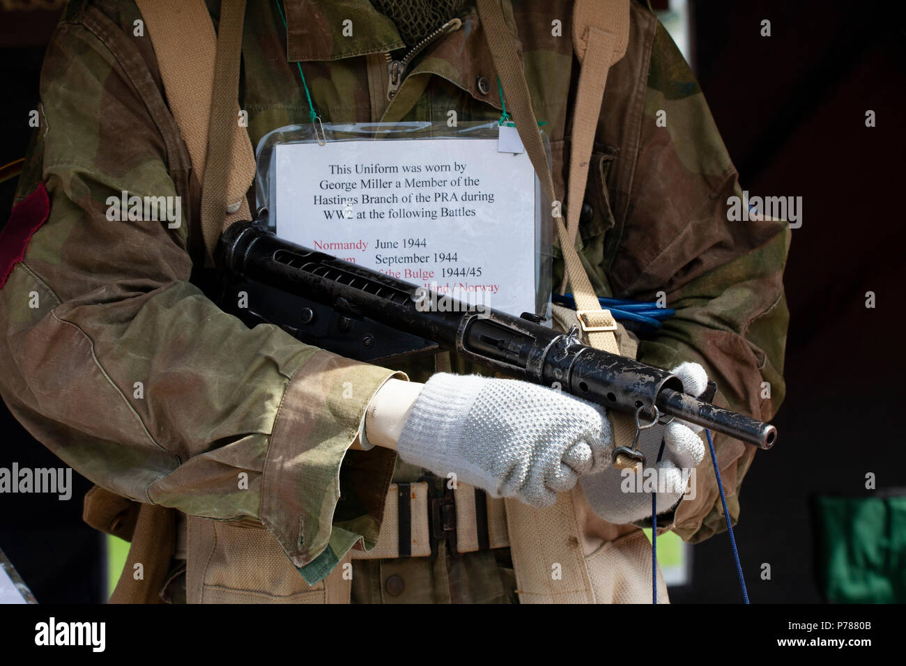 WWII uniform on display with machine gun, uk Stock Photo - Alamy