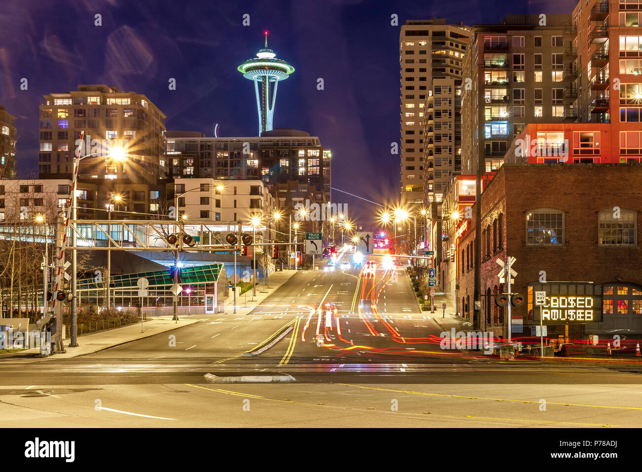 Light trails on the road at night with the The Space Needle in the ...