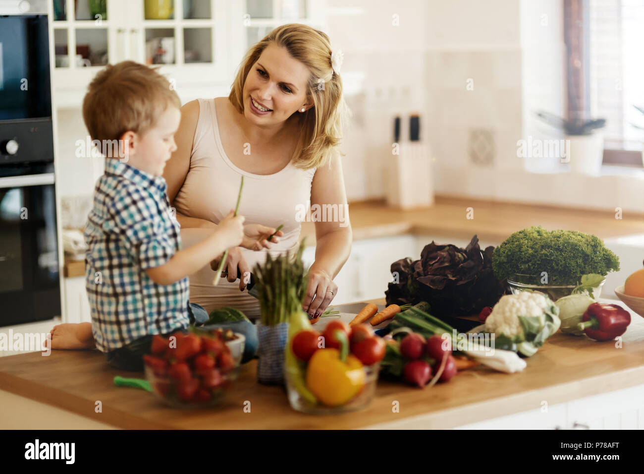 Mother and child preparing lunch Stock Photo - Alamy