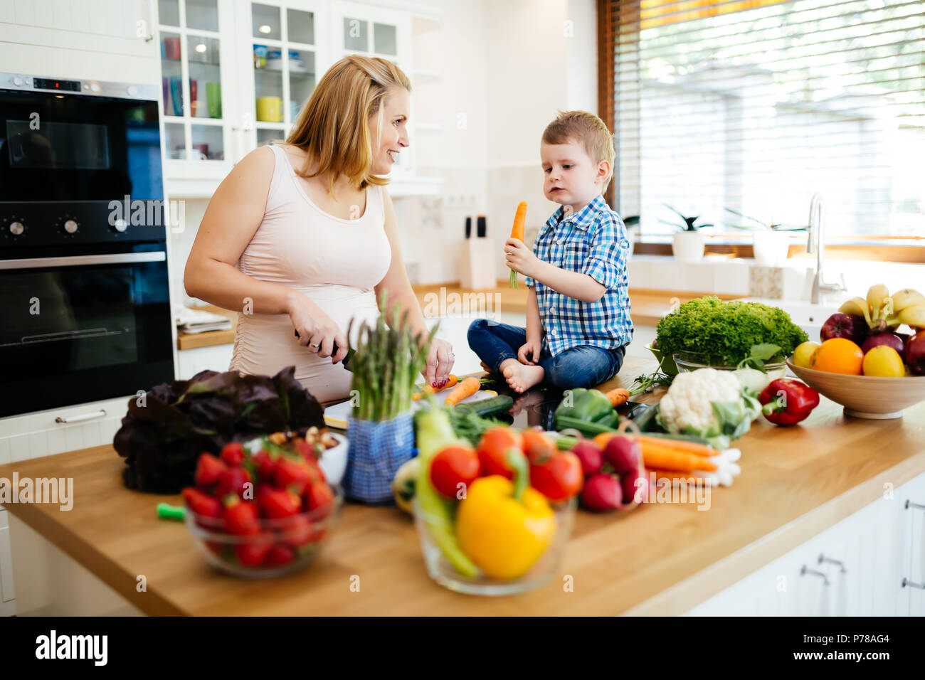 Mother and child preparing lunch Stock Photo - Alamy