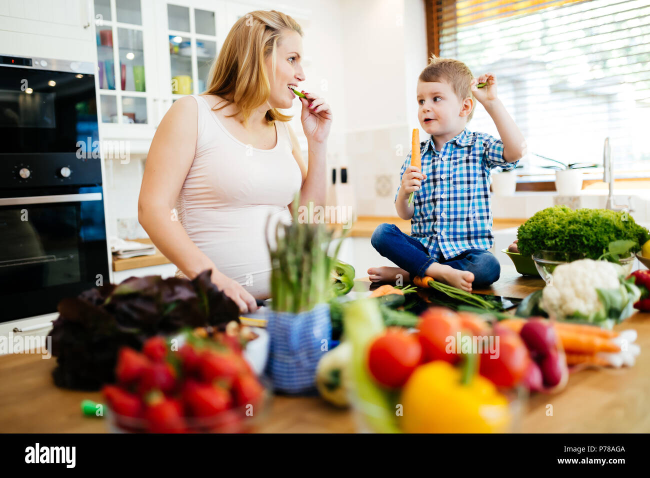 Mother and child preparing lunch Stock Photo - Alamy
