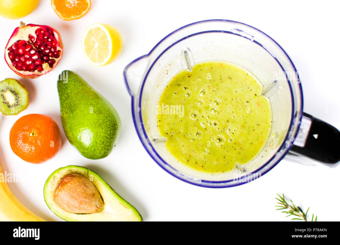 Healthy avocado smoothie in a blender with various fruits Stock Photo ...