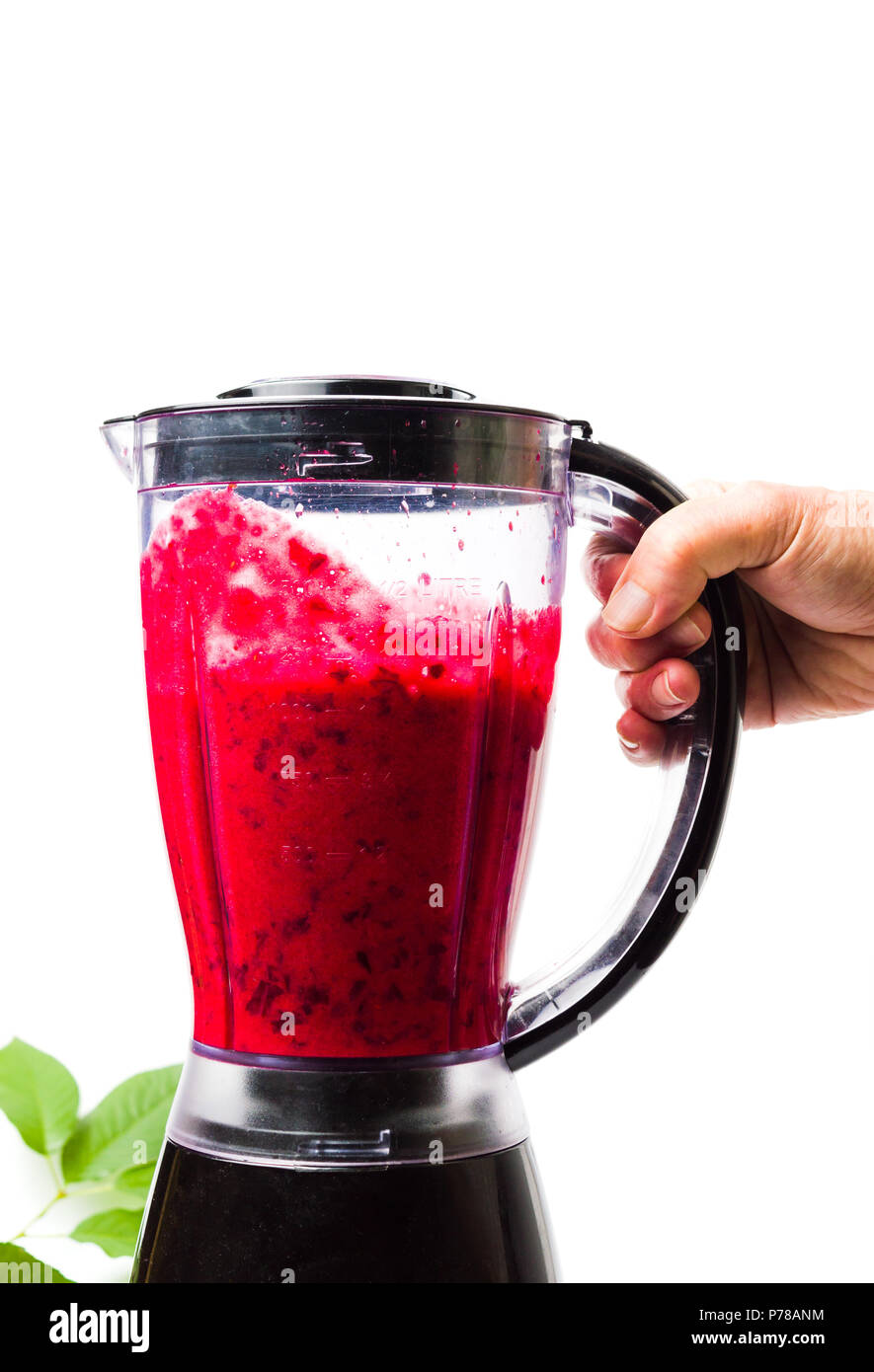 Person making cherry smoothie with a blender isolated Stock Photo - Alamy