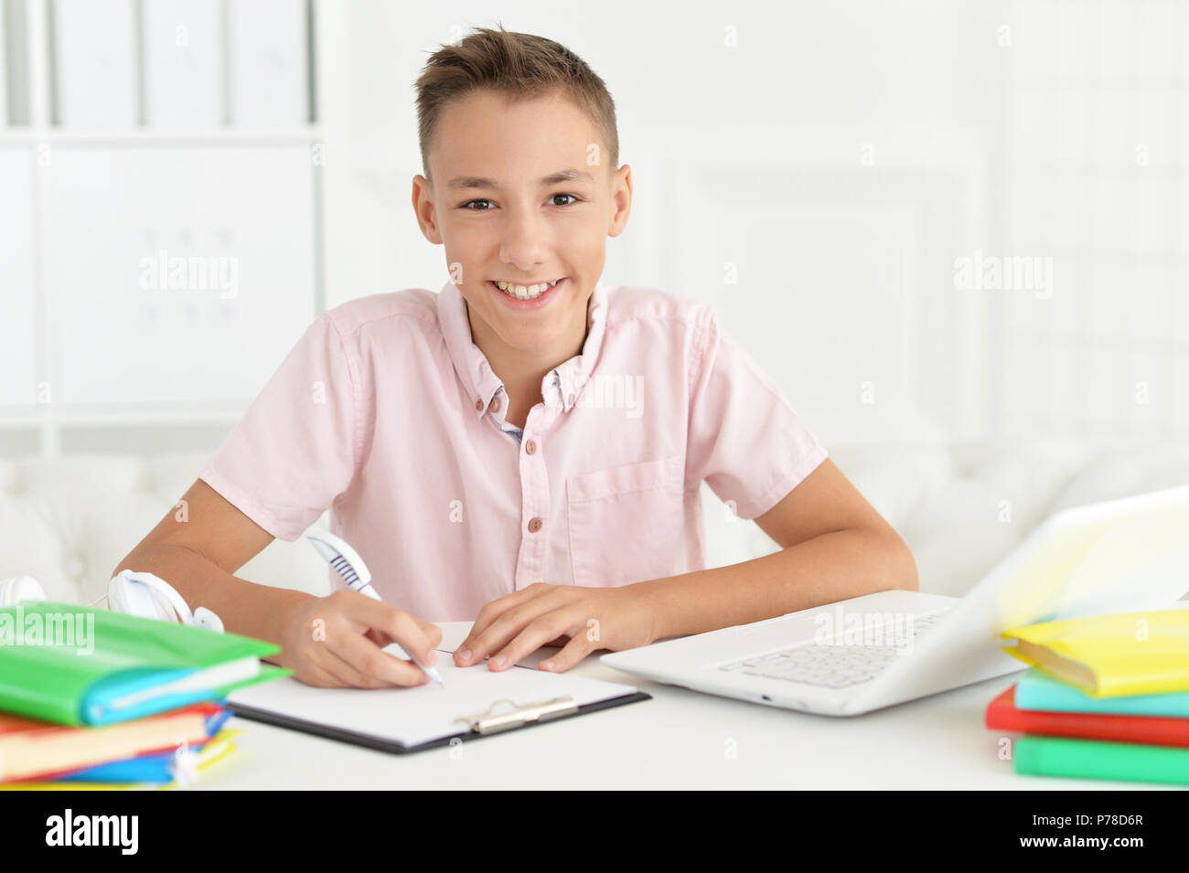 Young boy doing homework Stock Photo - Alamy