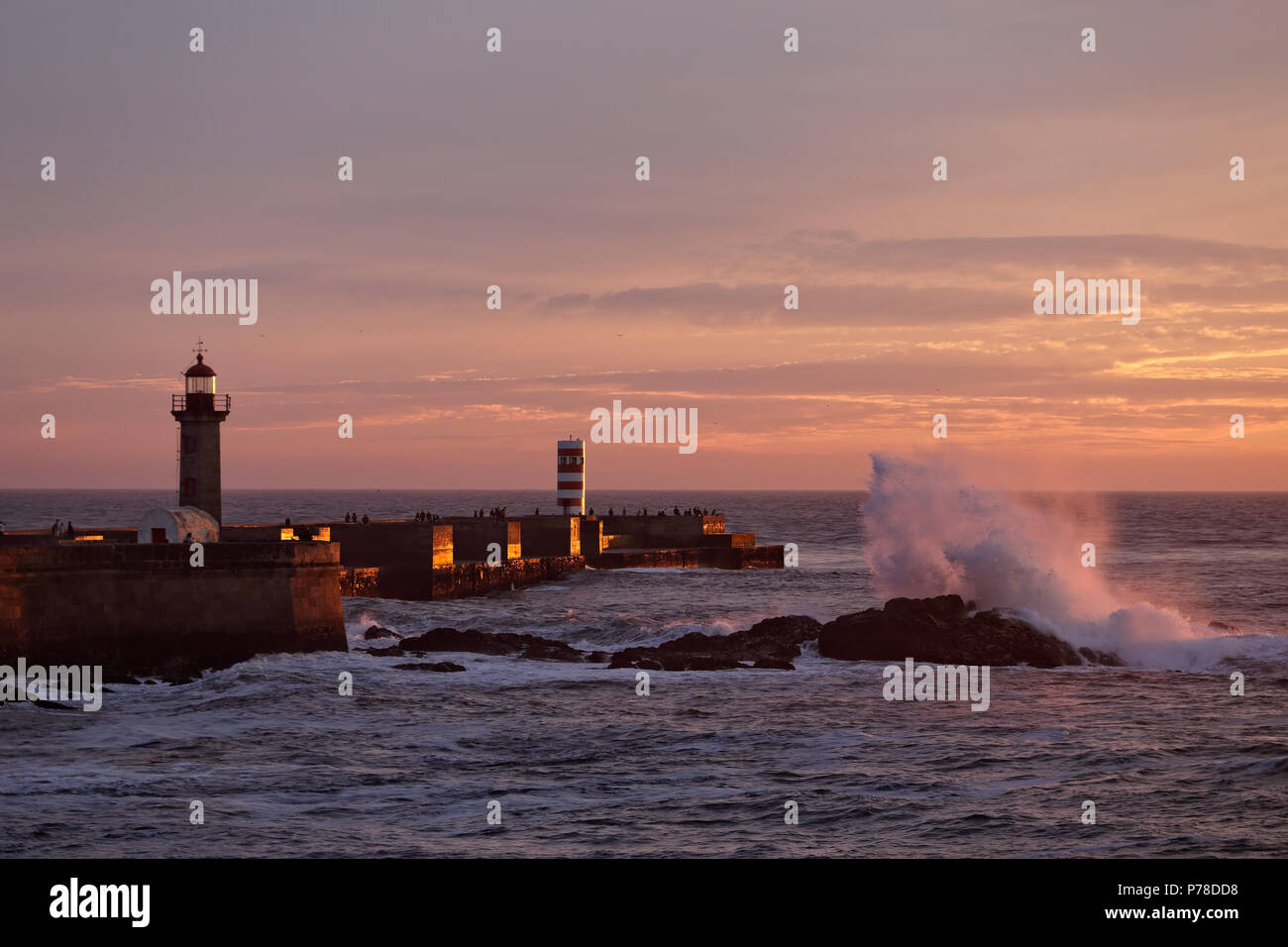 Douro river mouth harbor piers and lighthouses at beautiful orange dusk ...