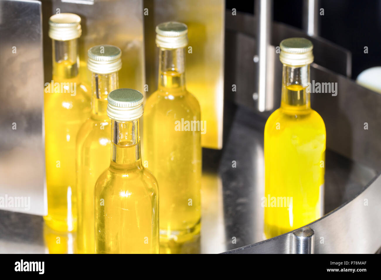 glass bottles with yellow liquid background image, exotic alcohol ...