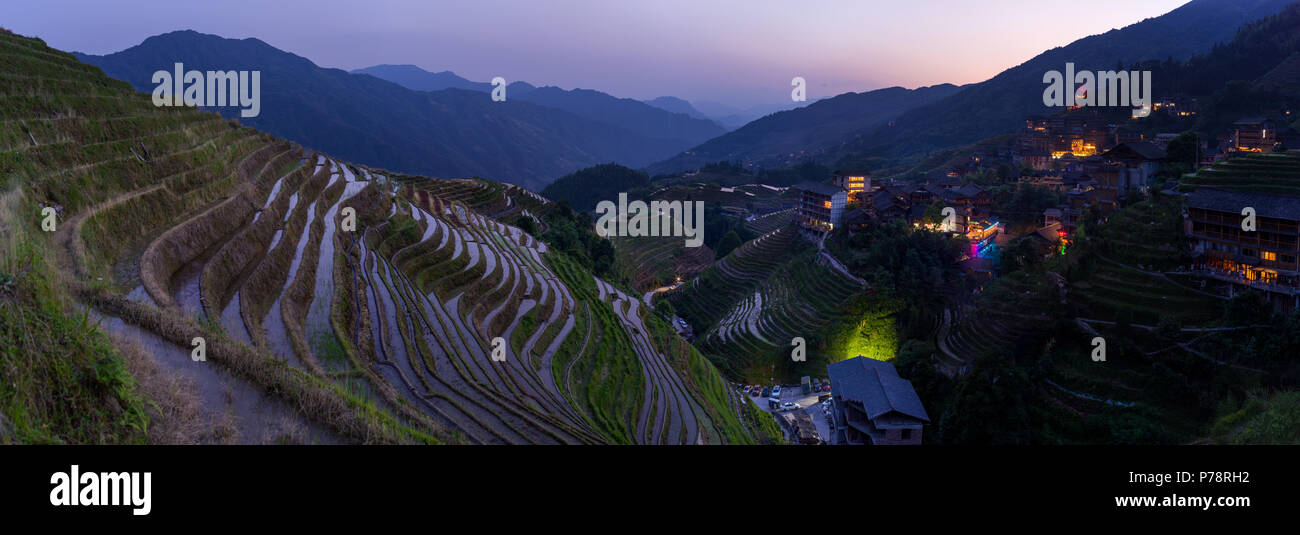 Longji Rice terraces with Longji village after sunset, Yunnan, China ...