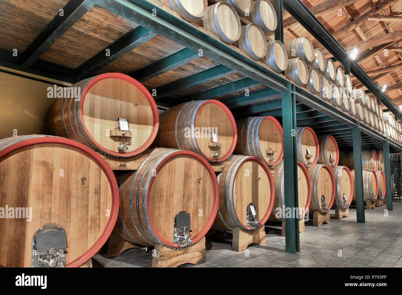 Casks in wine cellar and bottle Stock Photo - Alamy