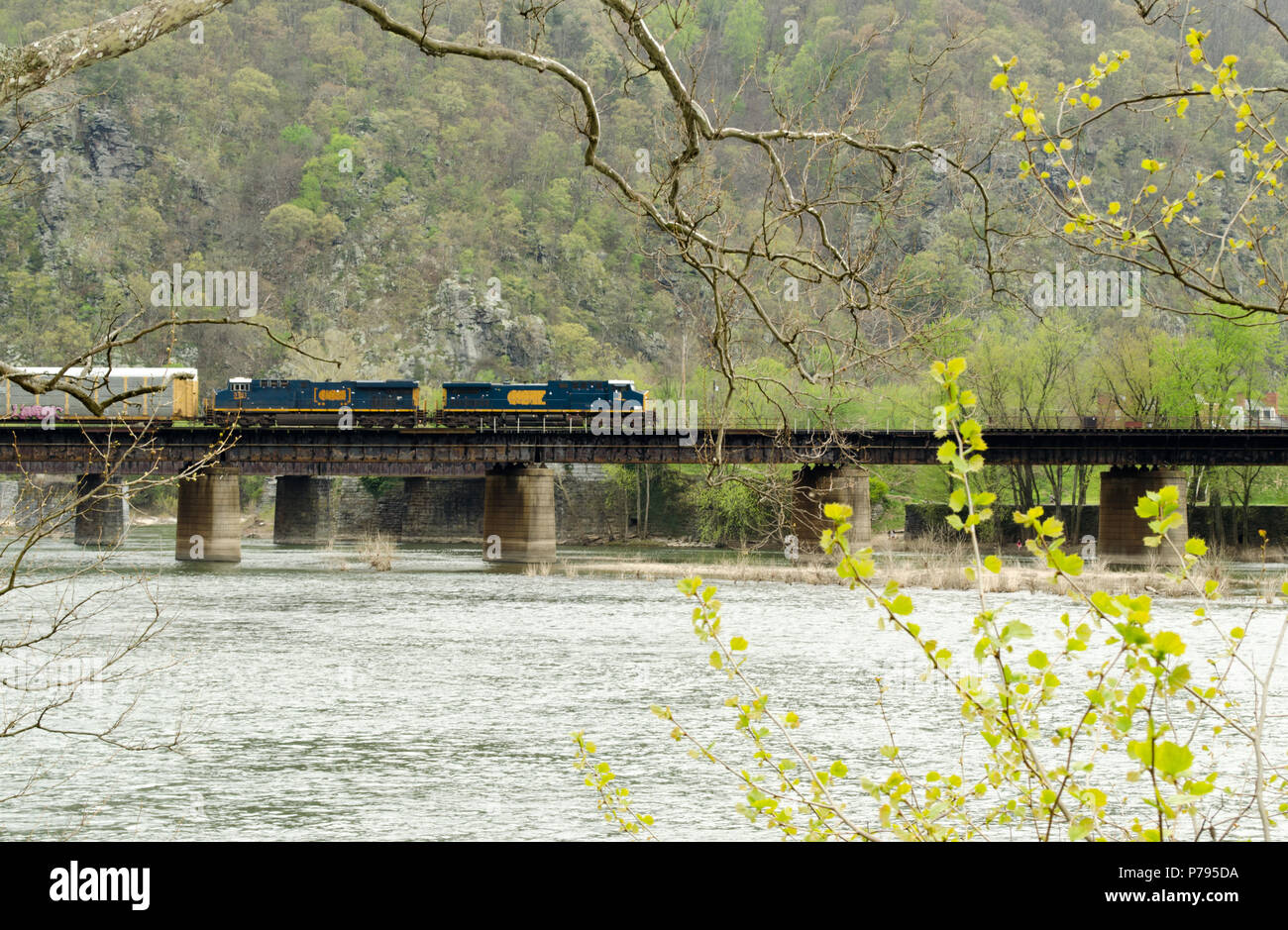 Train crossing river bridge Stock Photo - Alamy