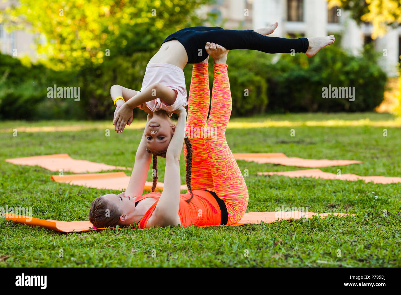Young acrobats family Stock Photo - Alamy