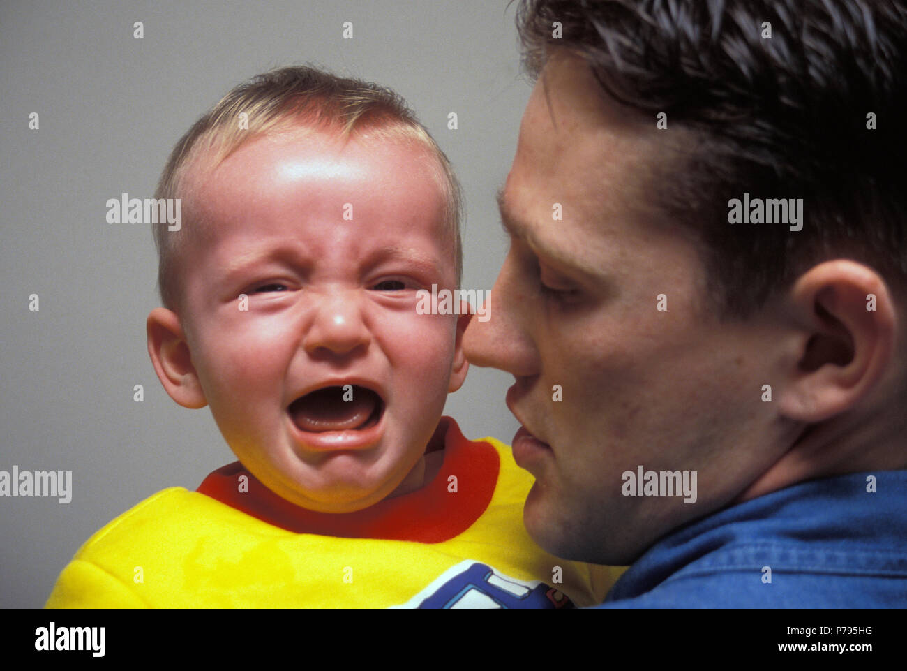 Father soothing crying baby hi-res stock photography and images - Alamy