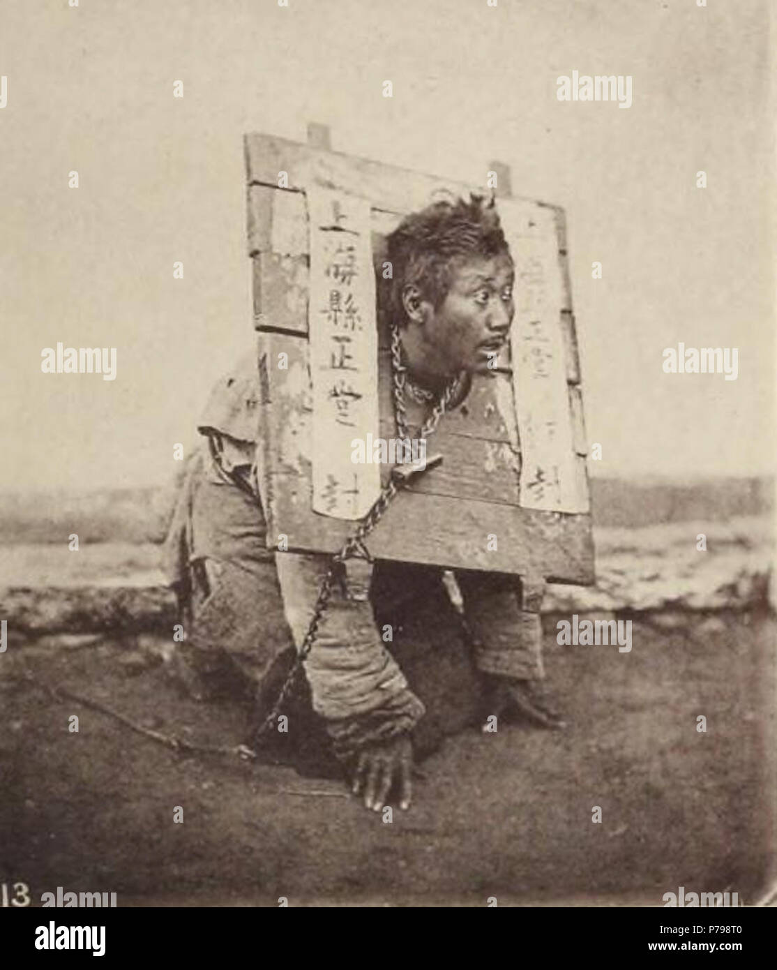 A man in a cangue in Shanghai. circa 1870 12 Cangue punishment Stock ...