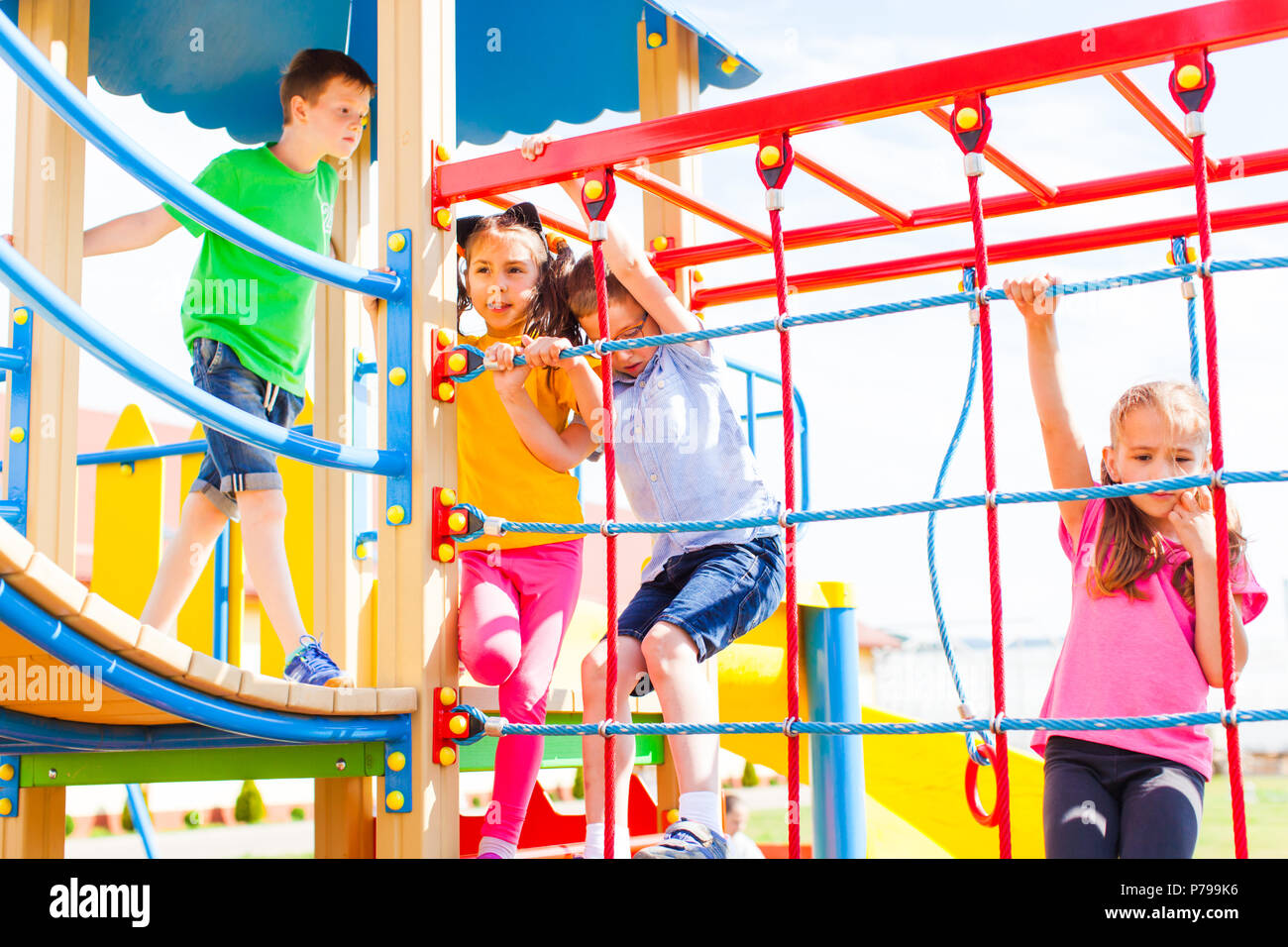 Overcoming obstacles at the playground Stock Photo - Alamy