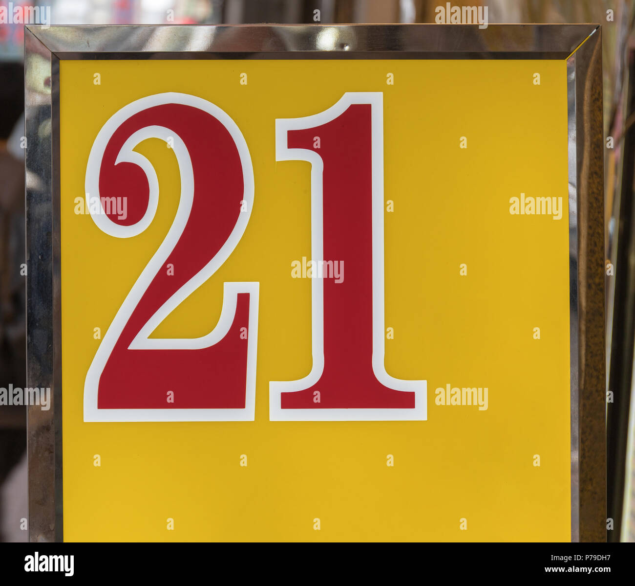 Red Twenty One Numbers at Yellow Foil Sign Stock Photo - Alamy
