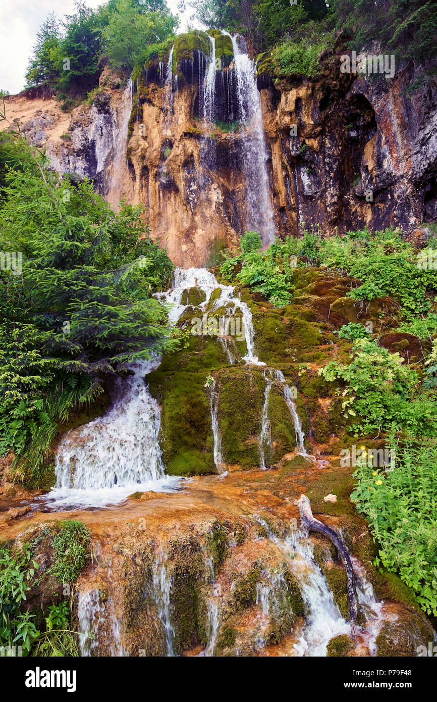 Landscape with a beautiful waterfall in a summer day Stock Photo - Alamy