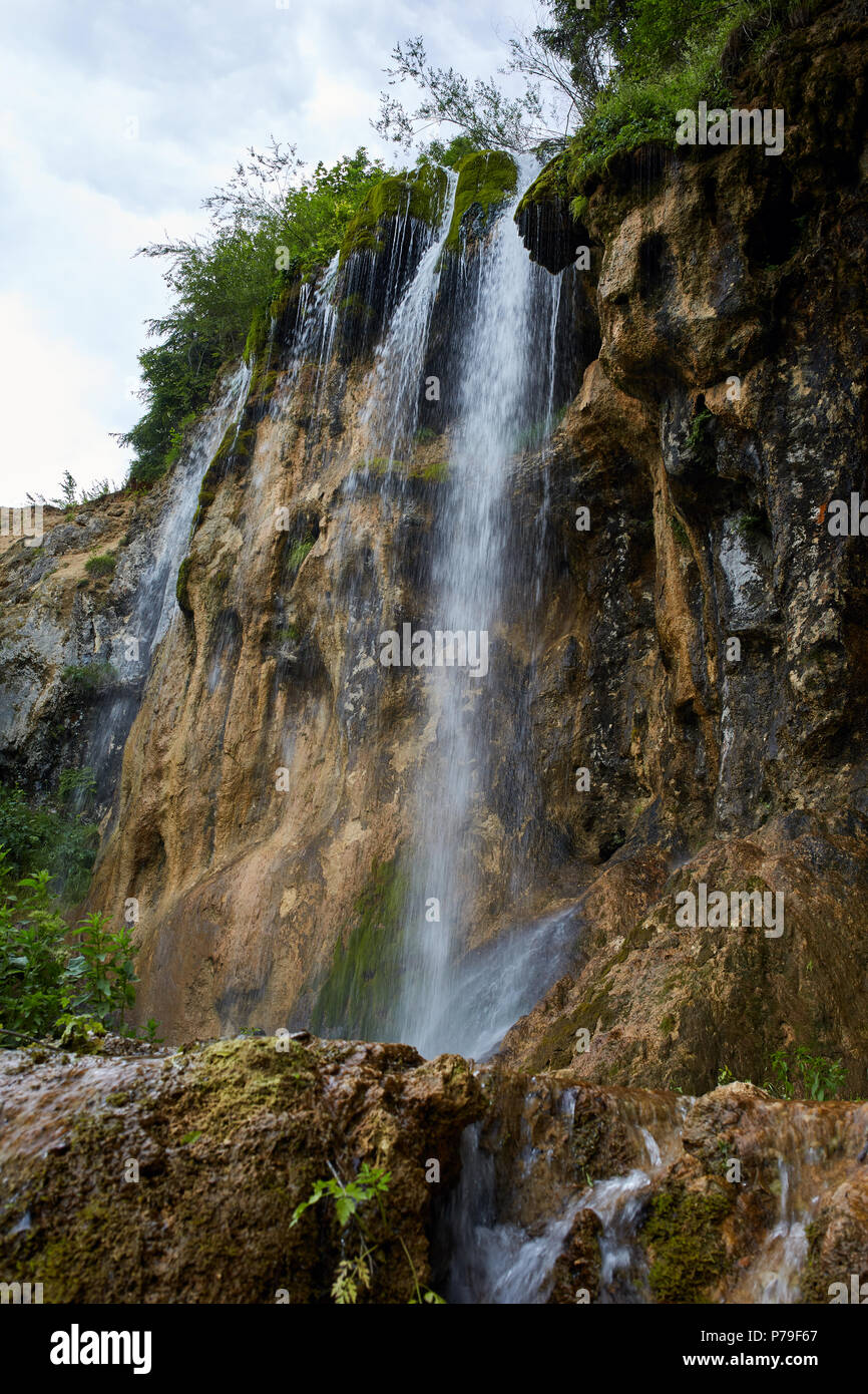 Landscape with a beautiful waterfall in a summer day Stock Photo - Alamy