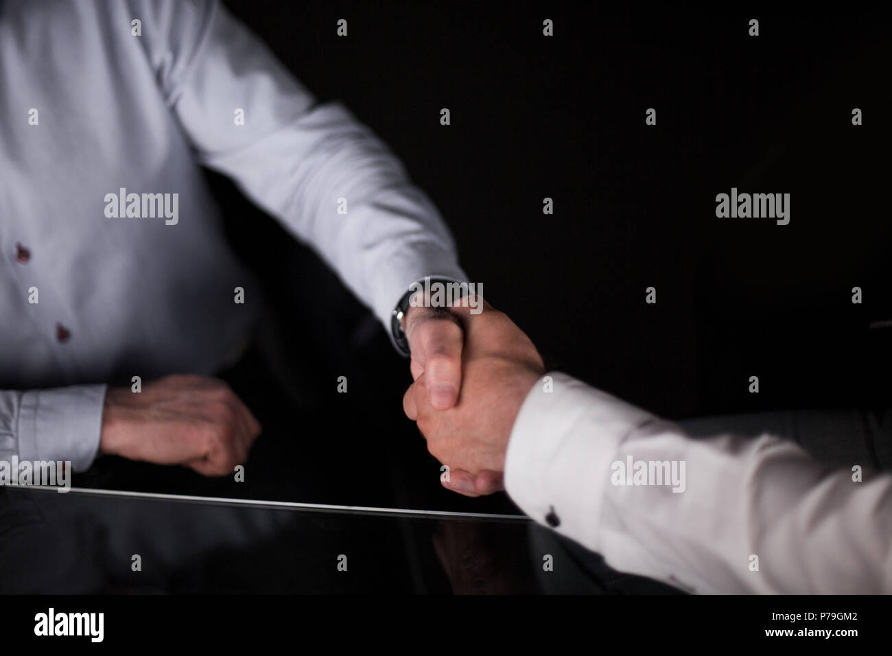 close up. a solid business handshake Stock Photo - Alamy