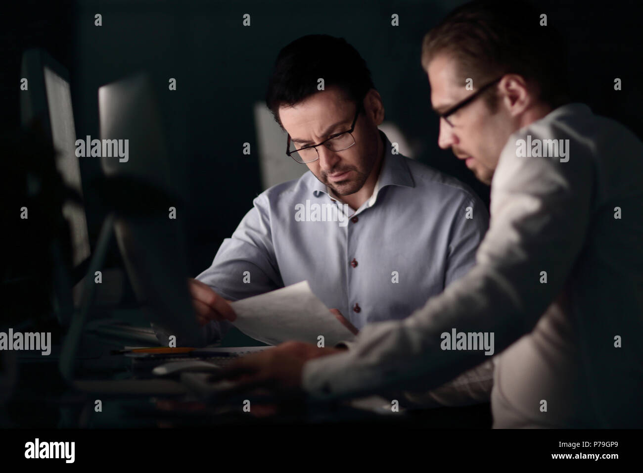 employees in the workplace overtime Stock Photo - Alamy