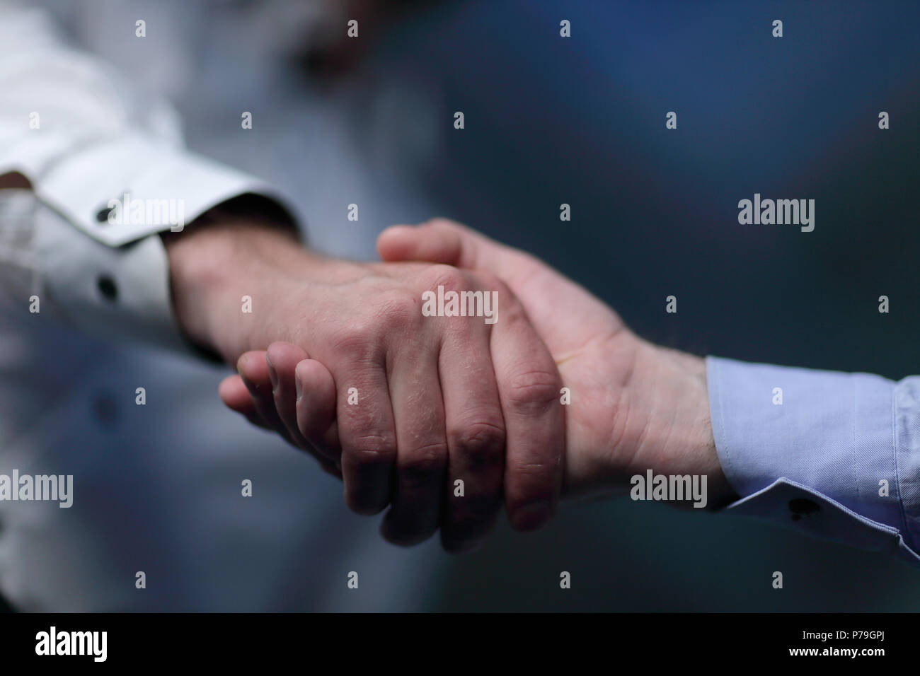 close up.confident handshake of business people Stock Photo - Alamy