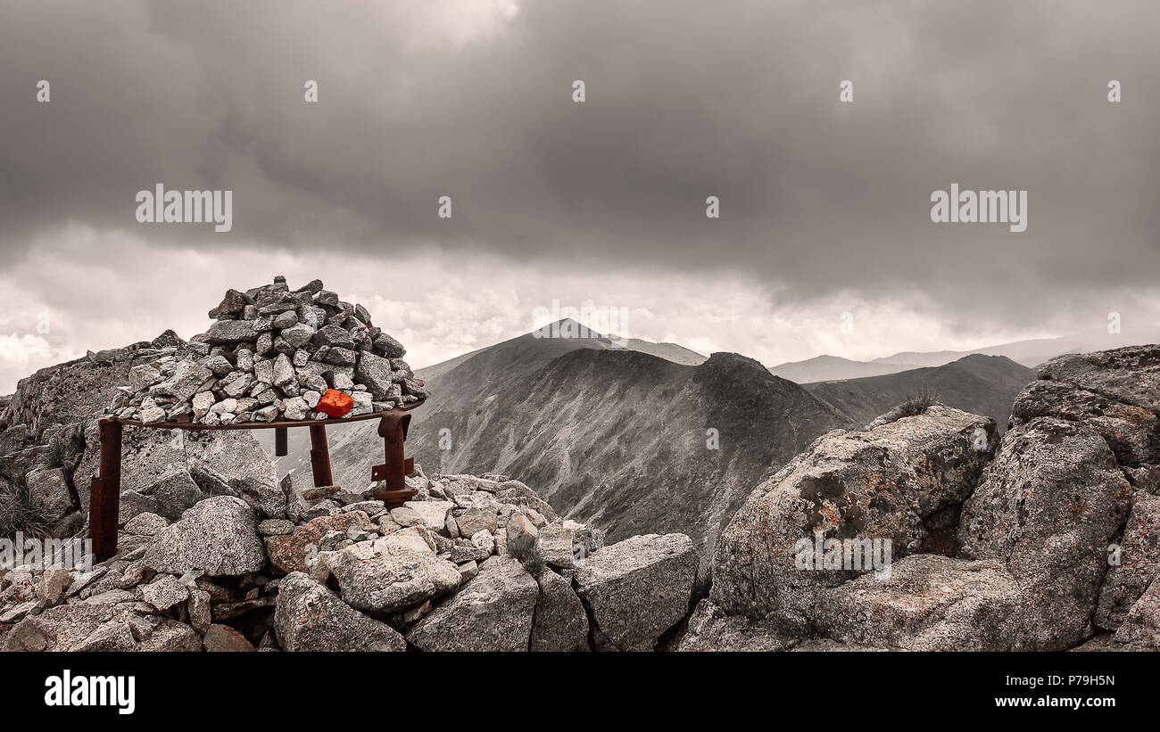 B&W view from Musala summit on Rila mountain, foreground pile of rocks ...