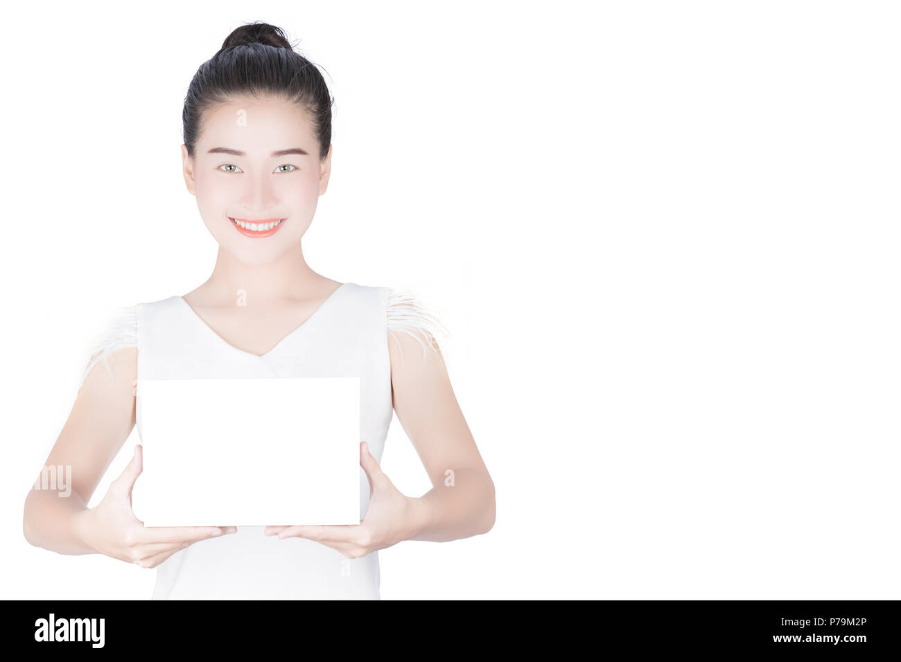 Woman holds the product for presentation. Lady beautiful in white shirt ...