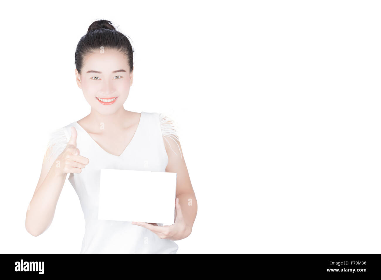 Woman holds the product for presentation. Lady beautiful in white shirt ...