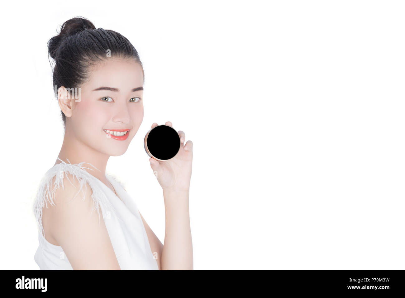 Woman holds the product for presentation. Lady beautiful in white shirt ...