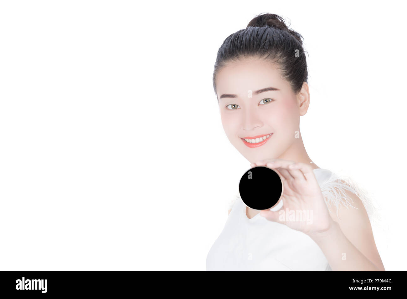 Woman holds the product for presentation. Lady beautiful in white shirt ...