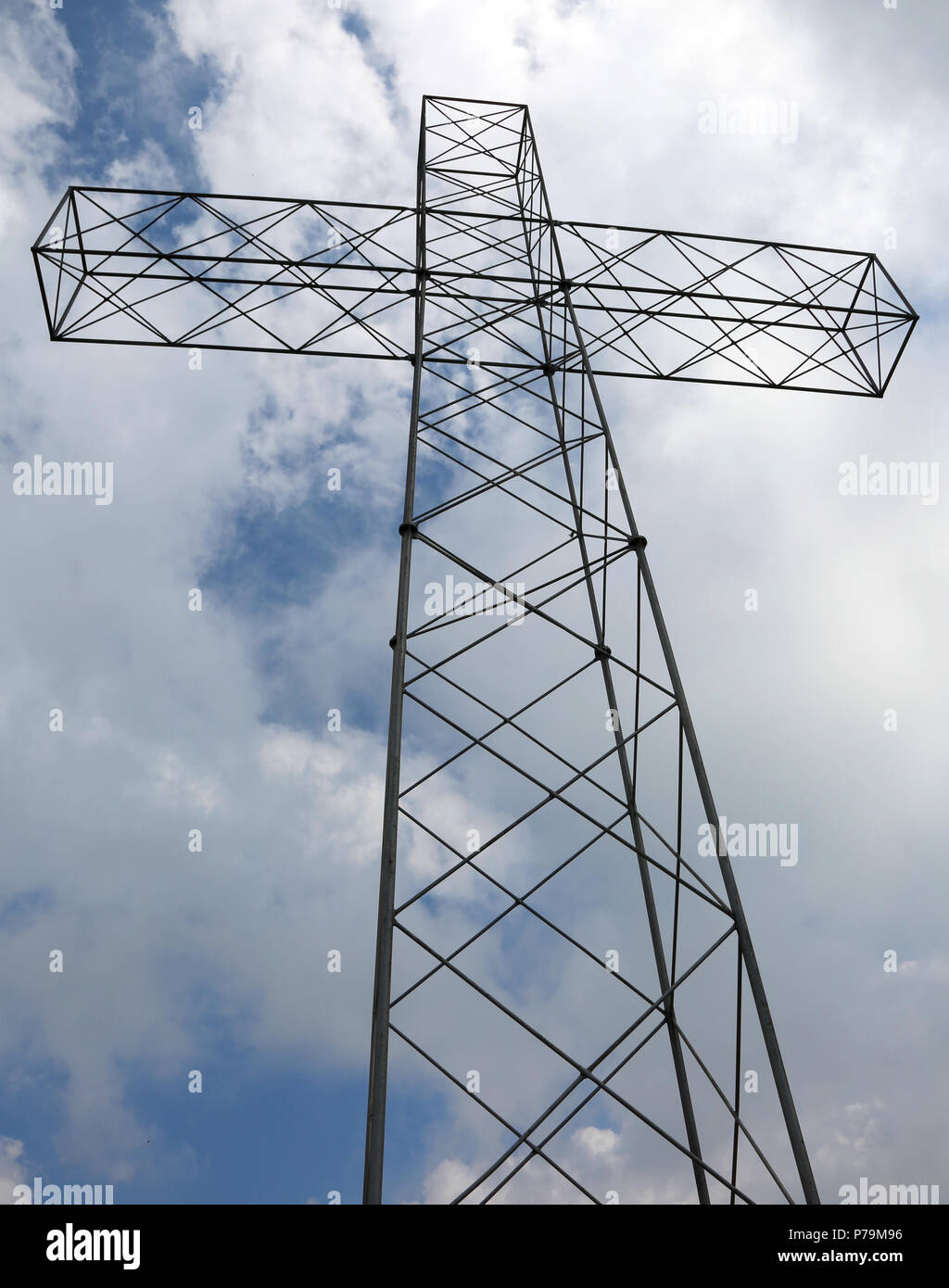 very high cross in vertical and white clouds on the sky i Stock Photo ...