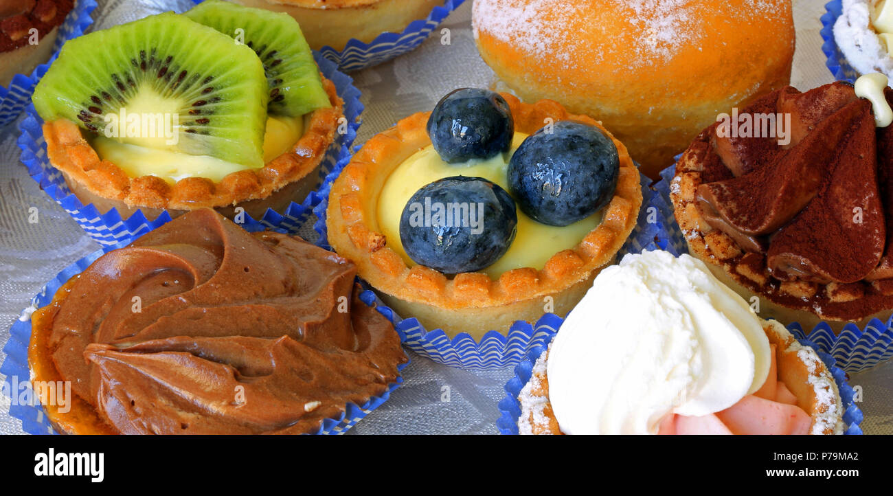 very colorful mignon pastries with big blueberries Stock Photo - Alamy