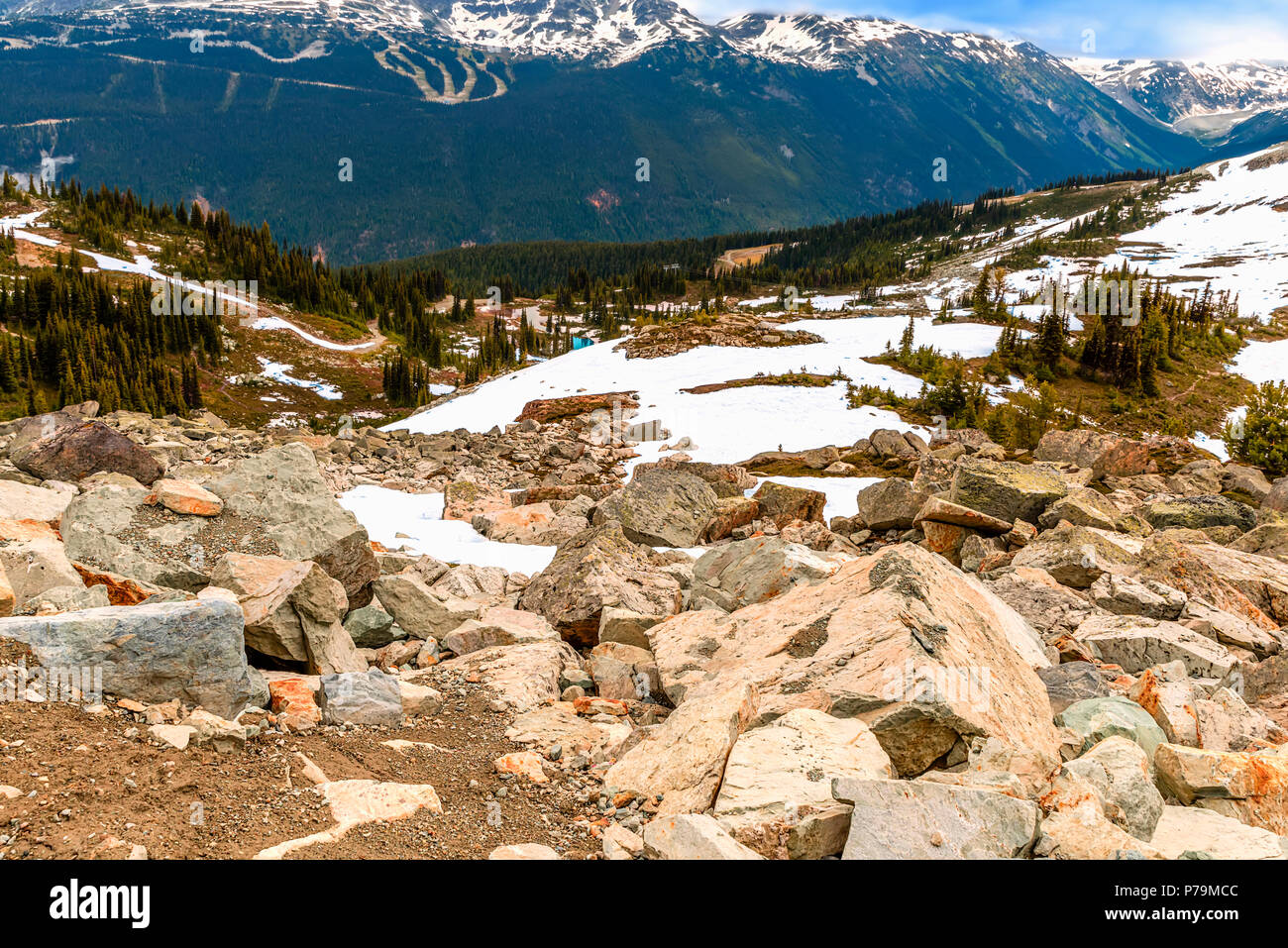 Rocky rocks, boulders, mountain slopes covered with snow, coniferous ...