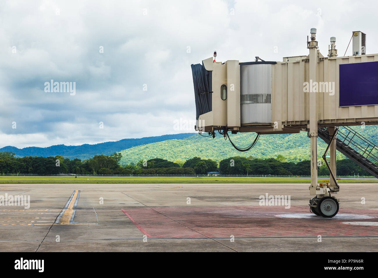 Jetbridge or passenger boarding bridge, PBB, stands waiting for ...