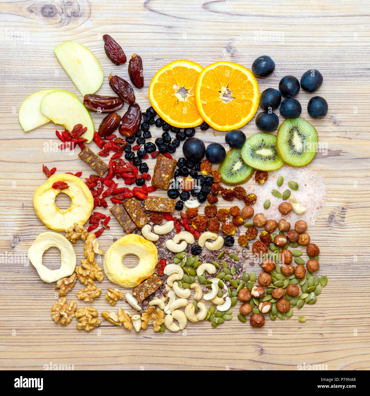 Mix of dried fruits, nuts and healthy raw snack bars background texture ...