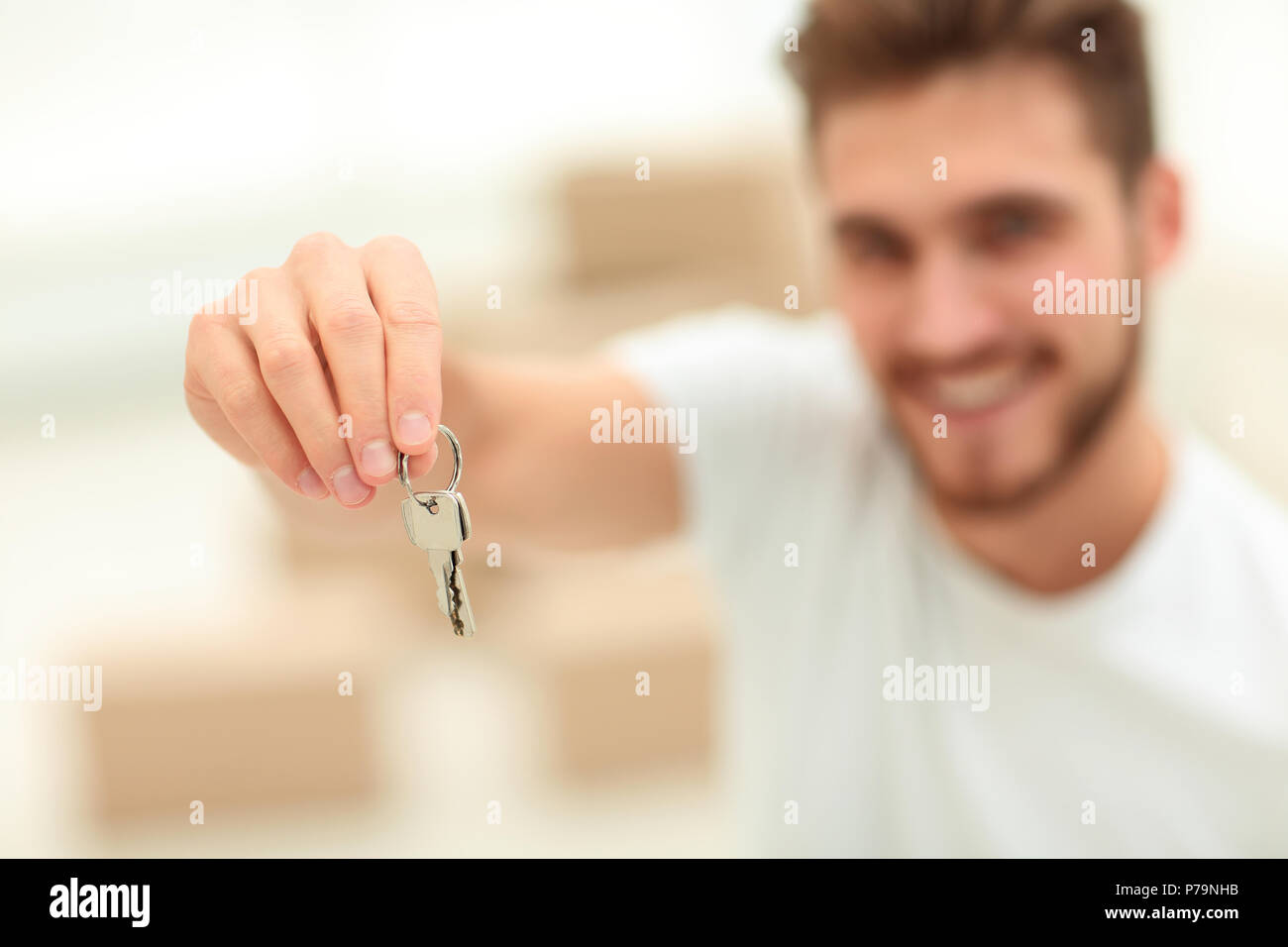 closeup.man showing keys of new apartments Stock Photo - Alamy