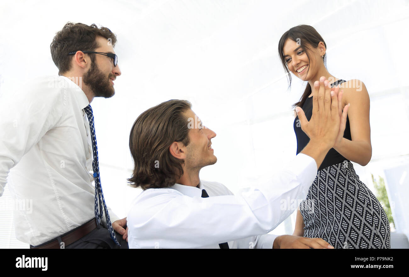 handsome man and beautiful woman giving hi five Stock Photo - Alamy