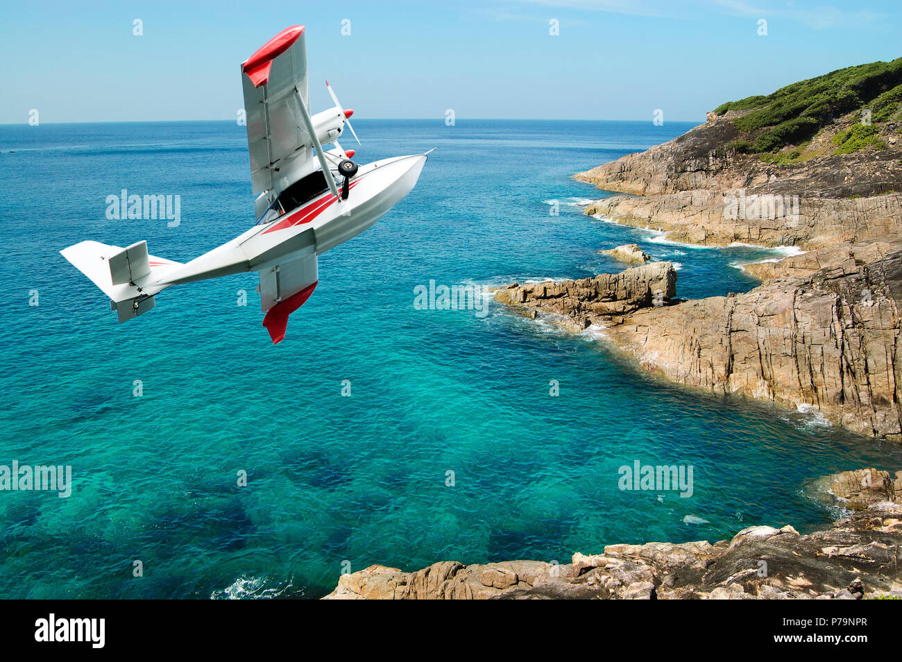 hydroplane flying over beauty rock-beach Indian Ocean in Thailand ...