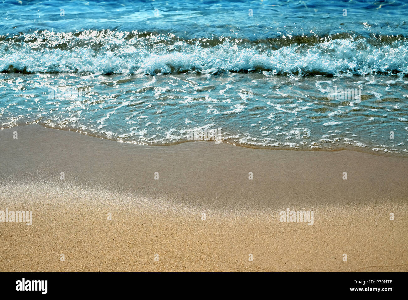 Ocean wave surf breaking on beach Stock Photo - Alamy