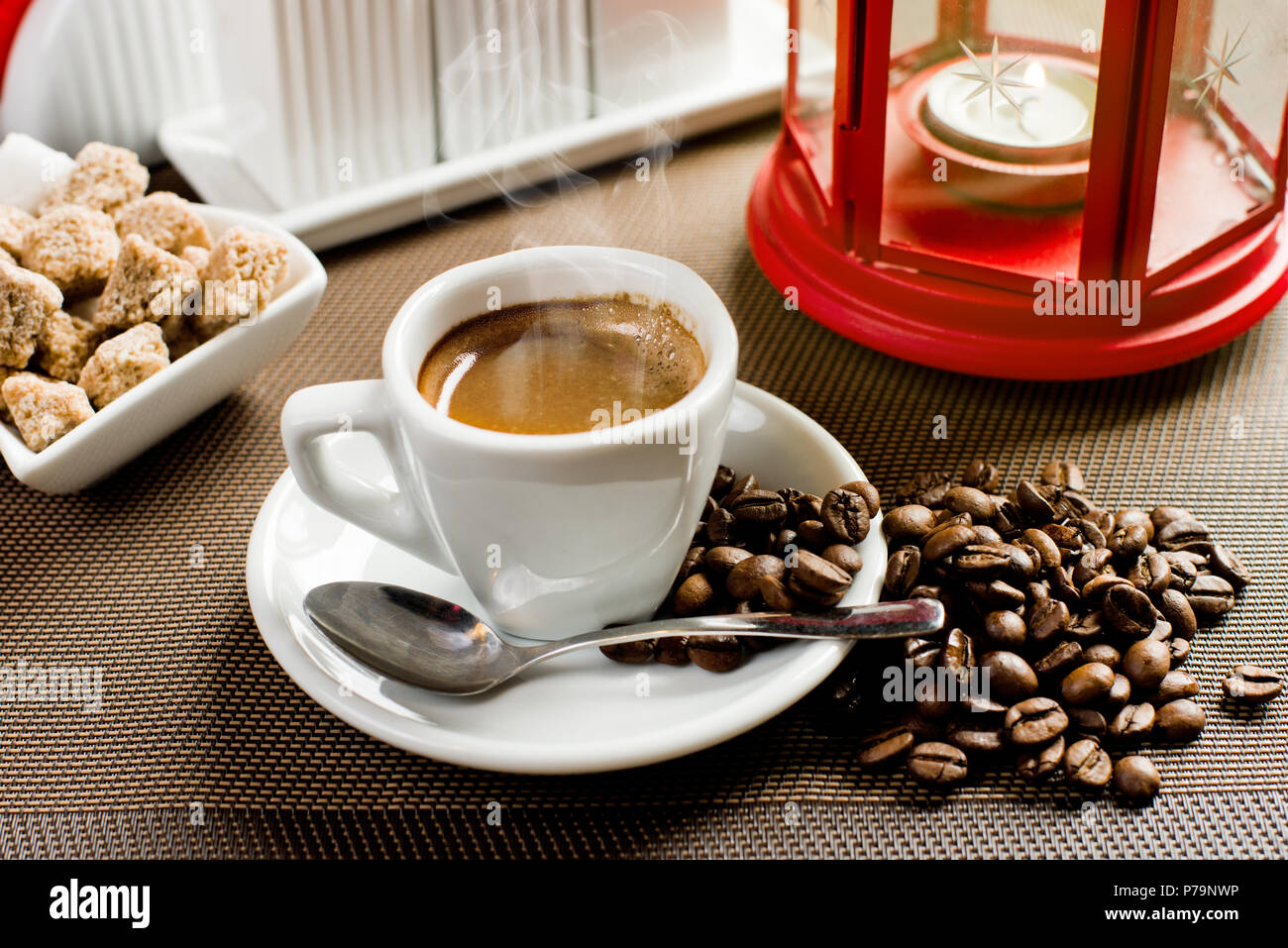 white cup with hot black coffee on table in coffee house, close up ...