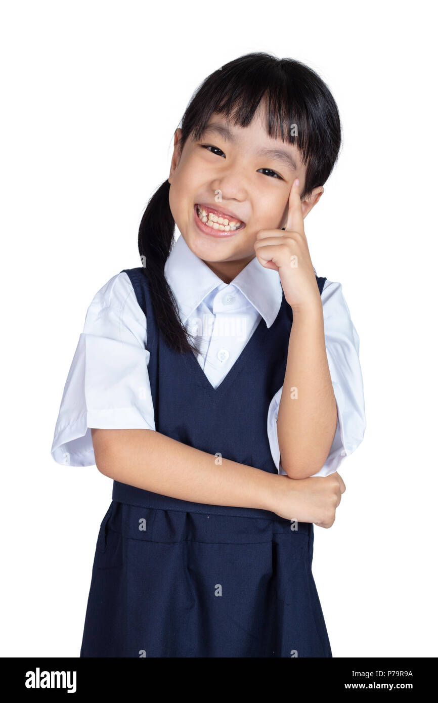 Asian Little Chinese Girl in uniform thinking in isolated White ...