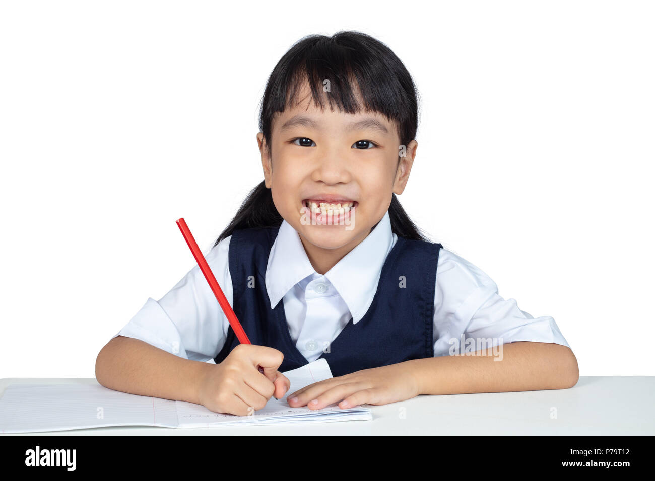 Asian Chinese little girl wearing school uniform studying in isolated ...