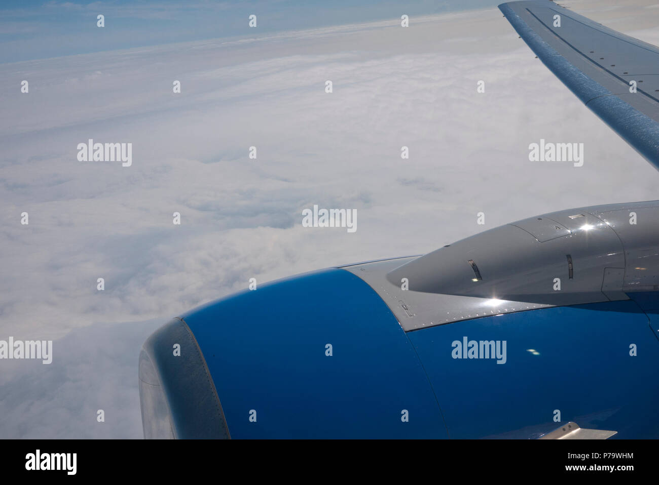 Wing and Jet engine of a Boeing 737 Jet 2 passenger aircraft flying ...