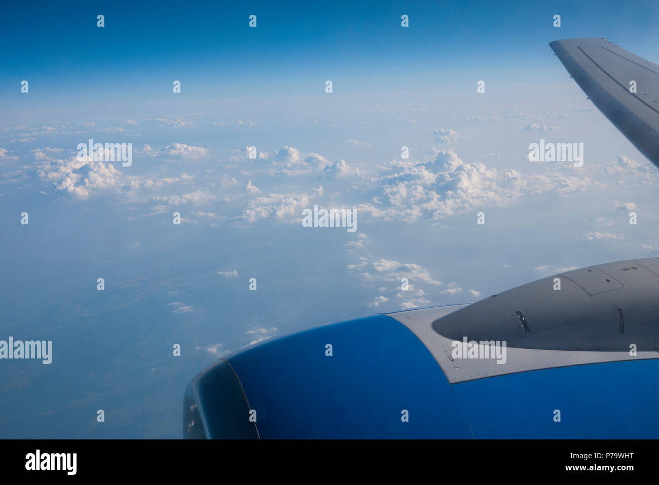 Wing and Jet engine of a Boeing 737 Jet 2 passenger aircraft flying ...