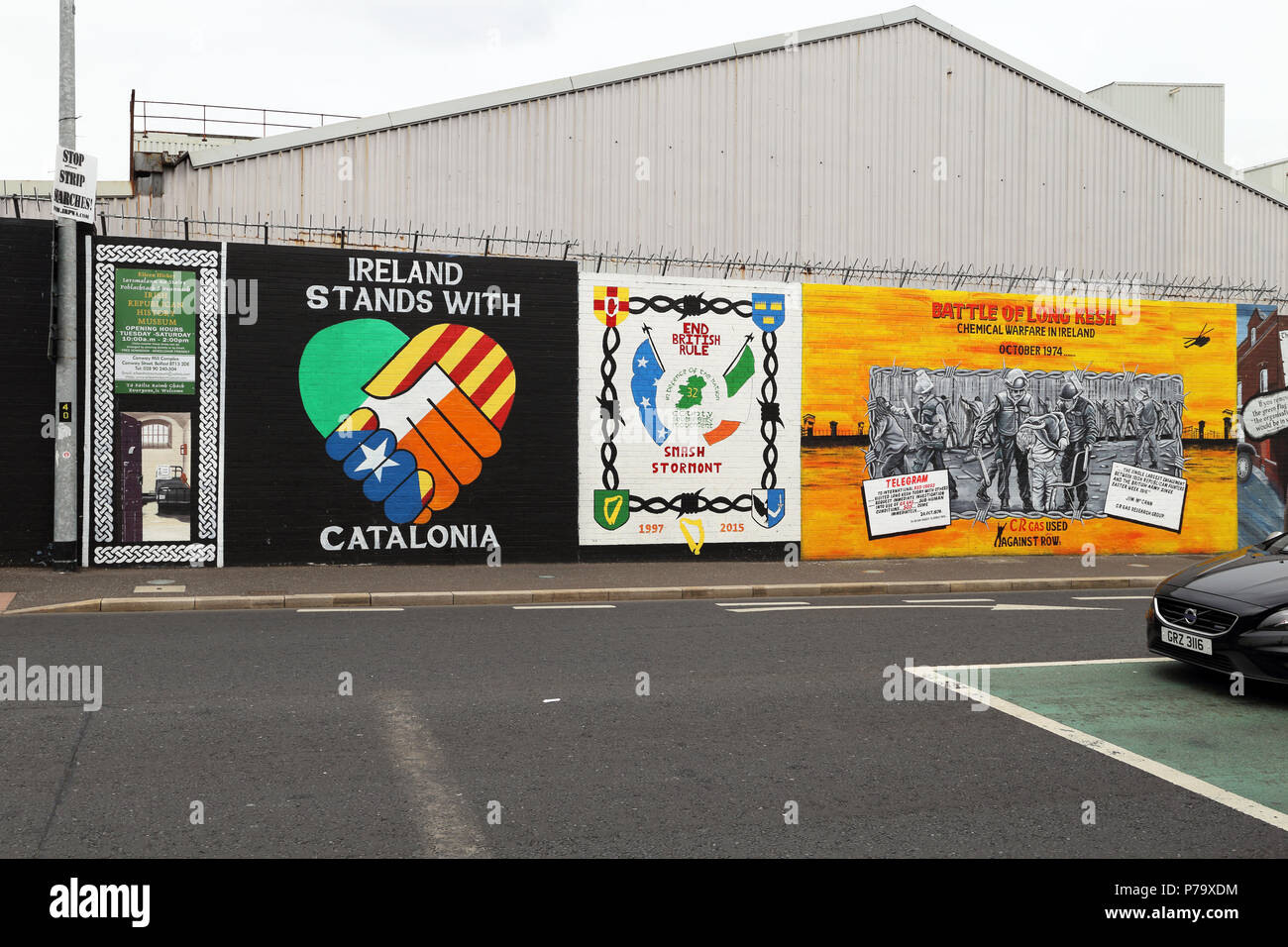 Political grafitti covers the Peace Wall in Belfast, Northern Ireland ...