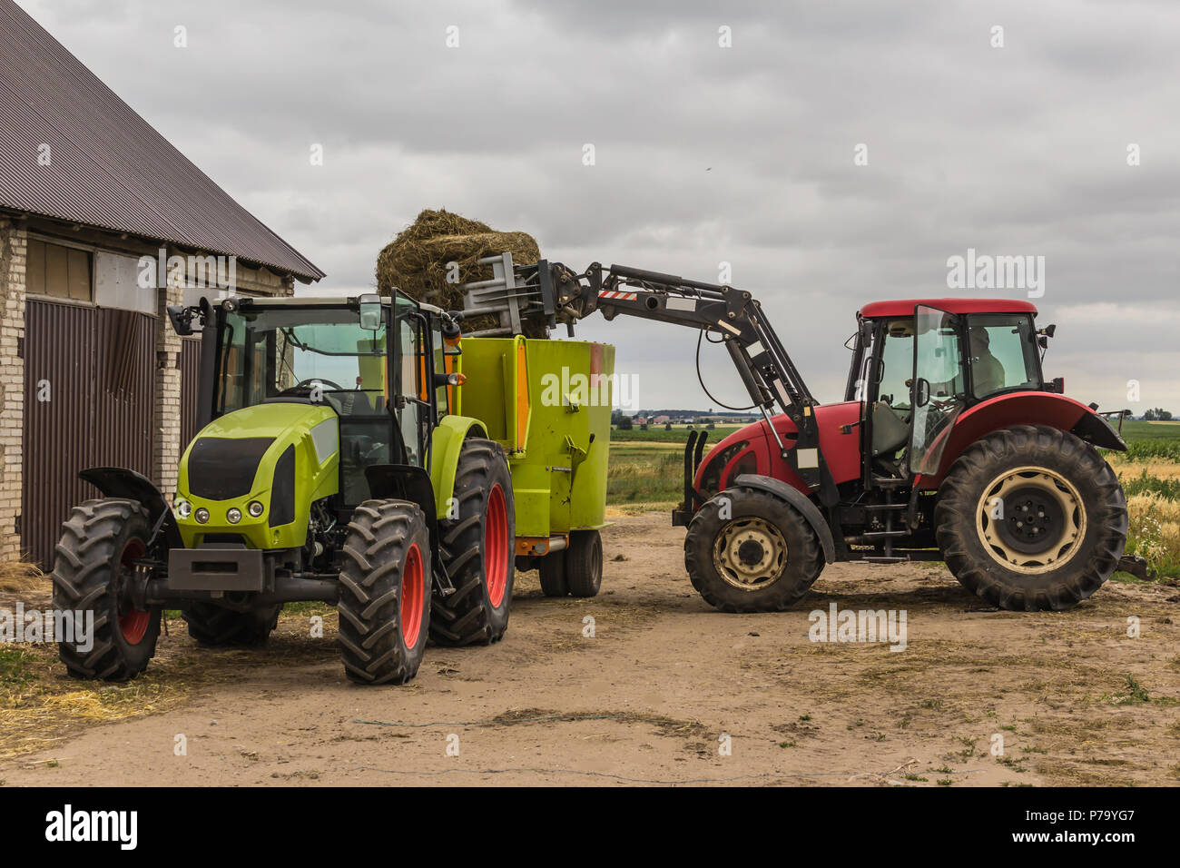 Agricultural machinery and equipment.The tractor with the loader loads ...