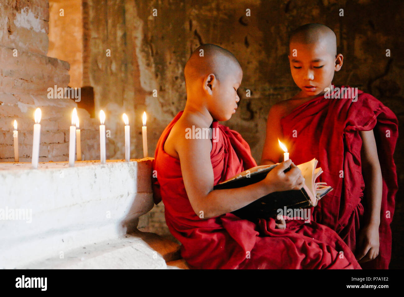 Two little monks in a ruin pagoda in Bagan, Myanmar Stock Photo - Alamy