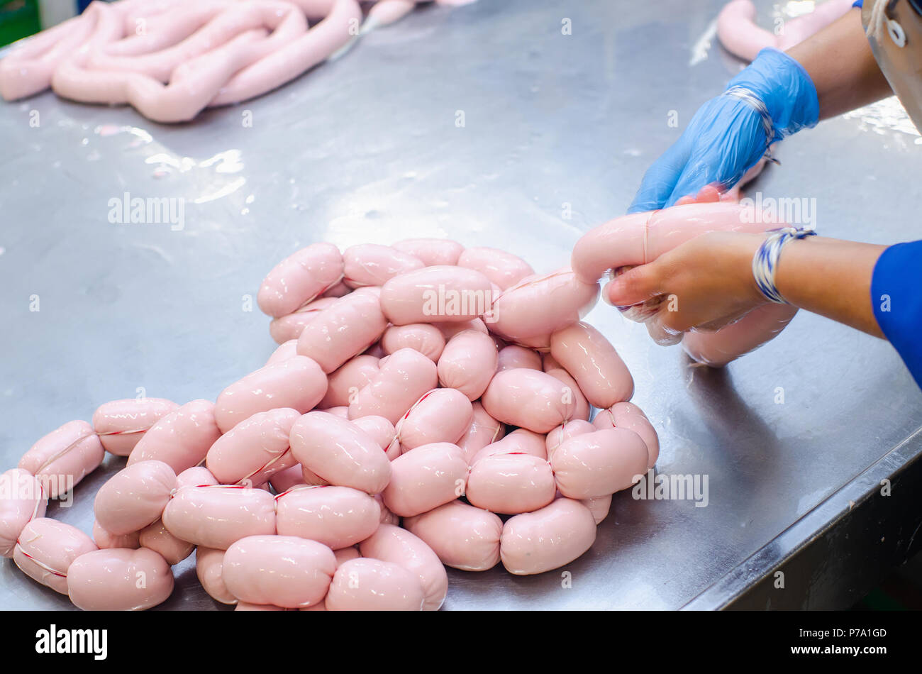 Sausage. Sausage production line. Process of sausage manufacturing ...